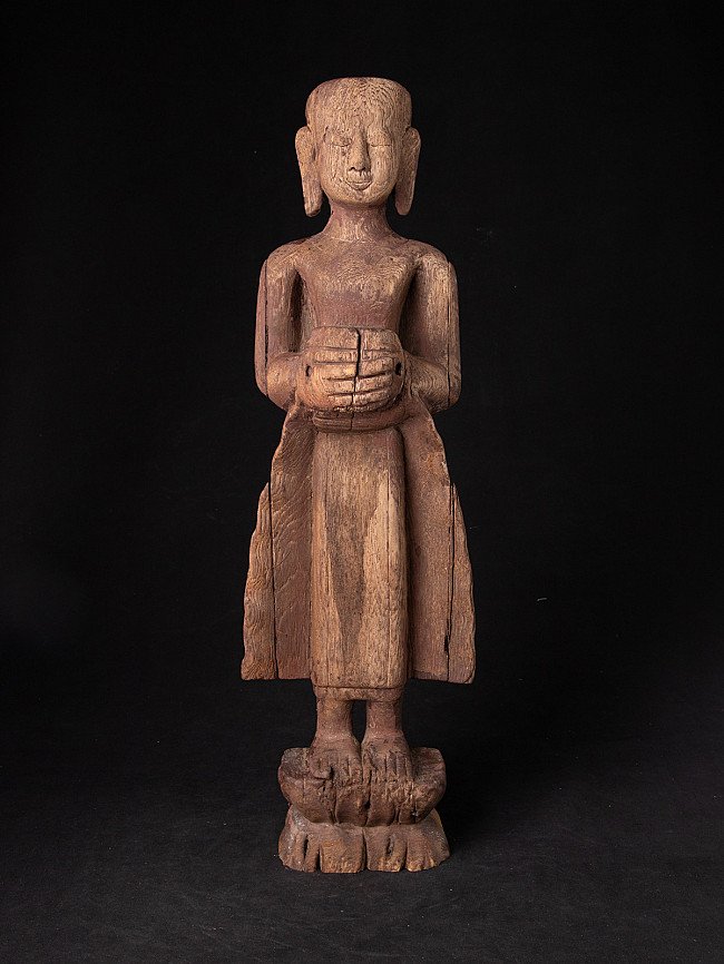 Antique standing monk statue from Burma