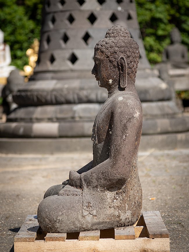 Old lava stone Buddha statue from Indonesia