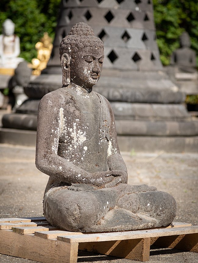 Old lava stone Buddha statue from Indonesia