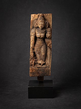 Antique wooden panel of the goddess Devi from India