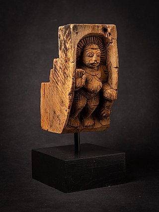 Antique wooden panel of the god Kuber from India