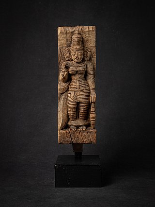 Antique wooden panel of the goddess Devi from India