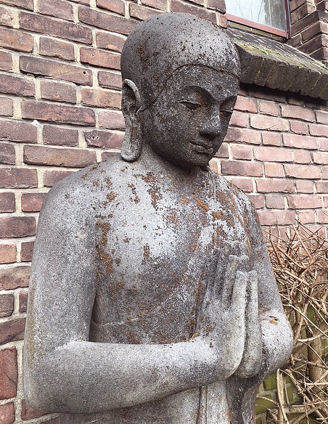 Large lavastone Monk statue from Indonesia