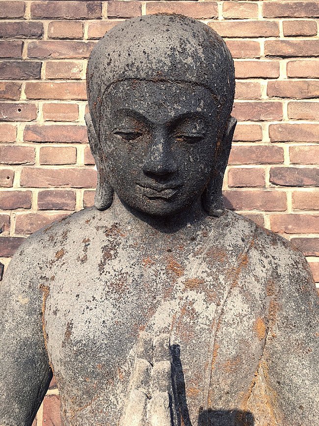 Large lavastone Monk statue from Indonesia