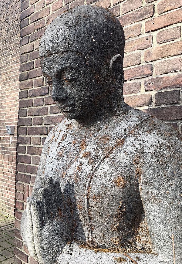 Large lavastone Monk statue from Indonesia